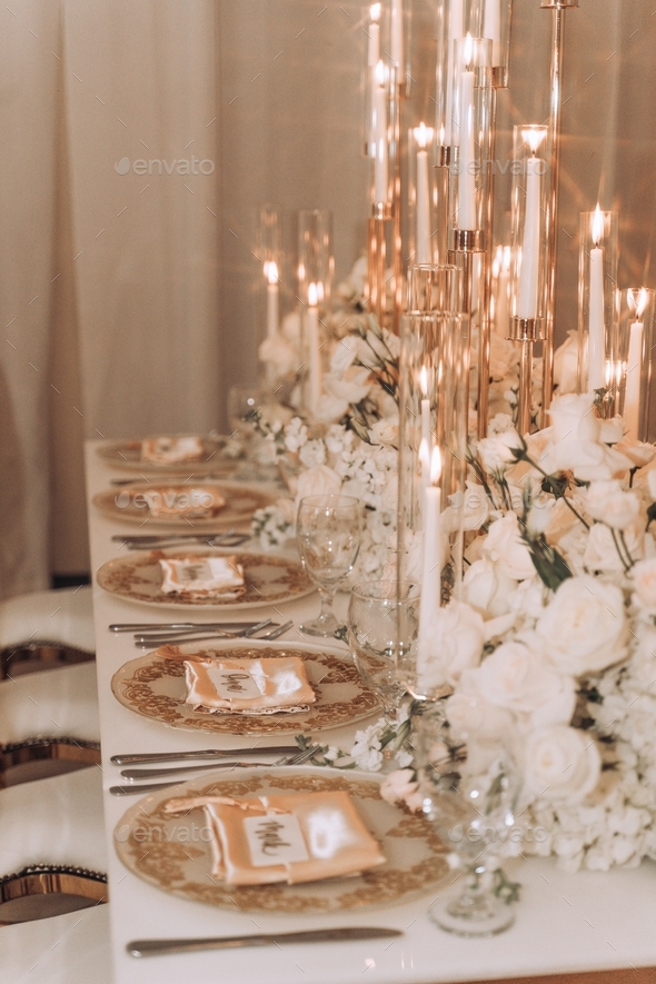 Elegant event set up with floral arrangements and candlelight Stock ...