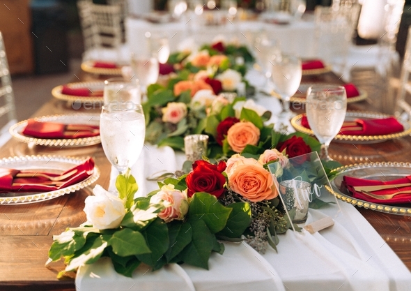 Romantic tablescape with red roses table setting for wedding event ...