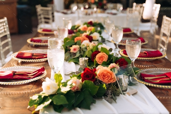 Romantic tablescape with red roses table setting for wedding event ...