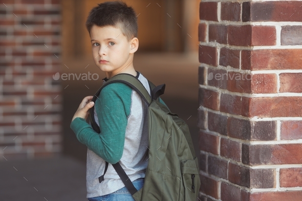 Sad little boy don’t want go to school Stock Photo by evgeniya_grande