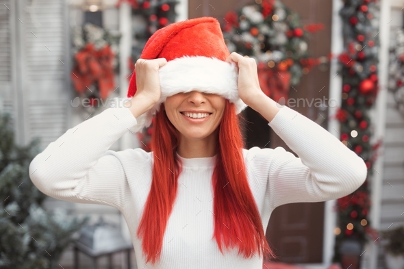 Faceless photo of laughing redhead girl celebrating christmas day in ...