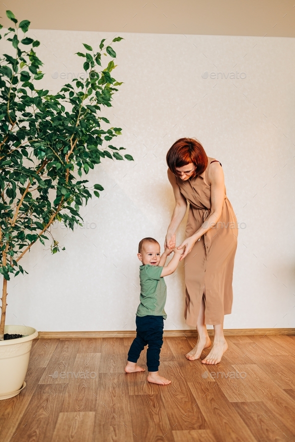 Funny family moments of mom and her son little kid baby boy indoors at ...
