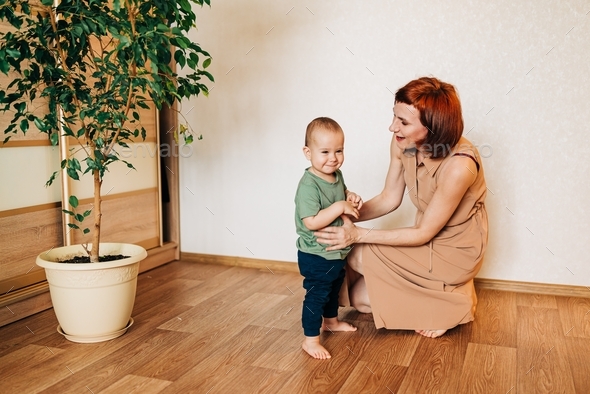 Funny family moments of mom and her son little kid baby boy indoors at ...