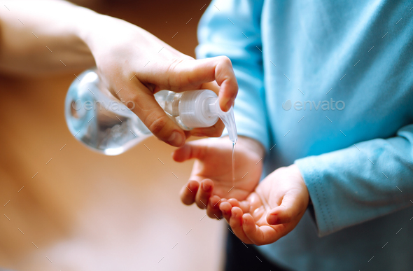 Hands with sanitizer gel. Mother and child using sanitize soap for hand ...