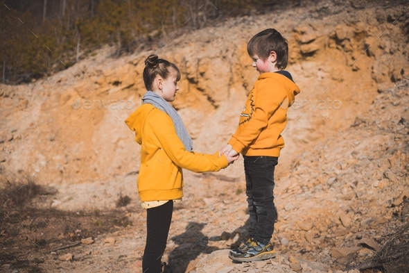 School children hold hands. Children's games and first feelings ...