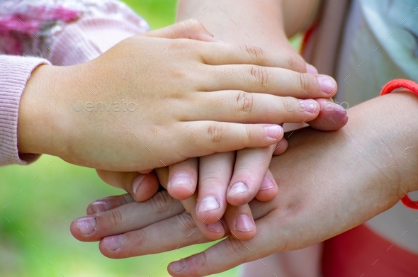 children hold each other's hands, arms folded symbolizing unity Stock ...