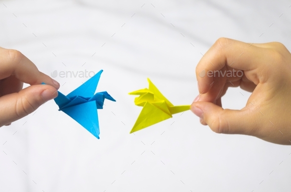 children holding in their hand origami paper, Stock Photo by TTereza