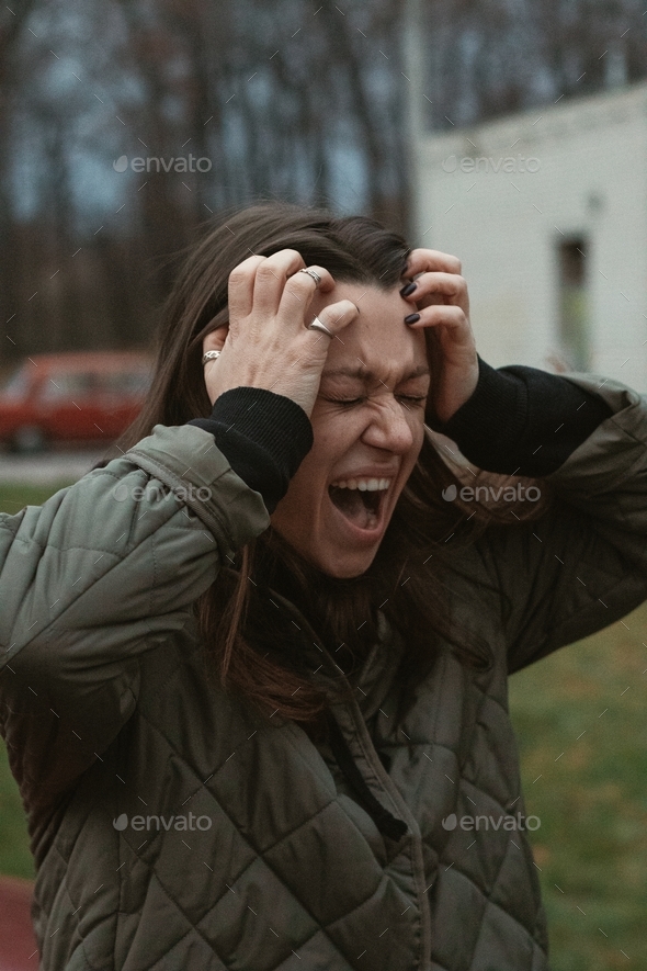 Screaming crying young woman on the street in twilight Stock Photo by ...