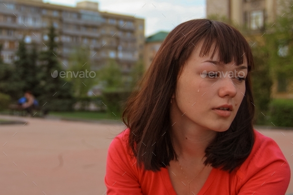 crying asian young woman outdoors in summer Stock Photo by loskyt7