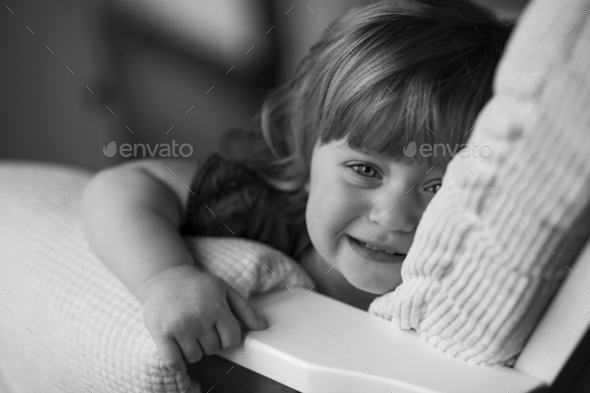 Emotion of pain. The little girl looks with a strained look. Half of ...