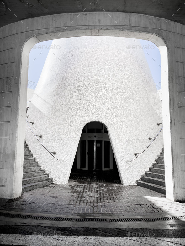 A conical structure houses an elevator surrounded by a staircase in the ...