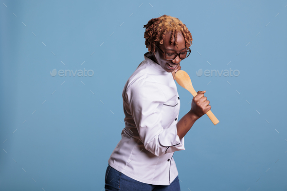 Cheerful female chef singing at work Stock Photo by DC_Studio | PhotoDune