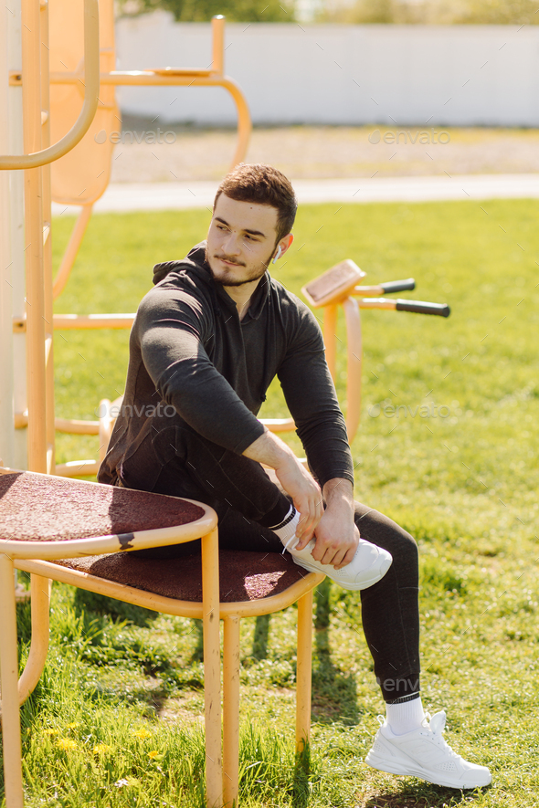 Male athlete doing fitness training. Workout outside the gym. Stock ...