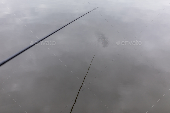 texture of water at lake with fishing rod and float Stock Photo by ...