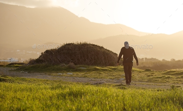 Man walking field sunset Stock Photo by alinabitta | PhotoDune