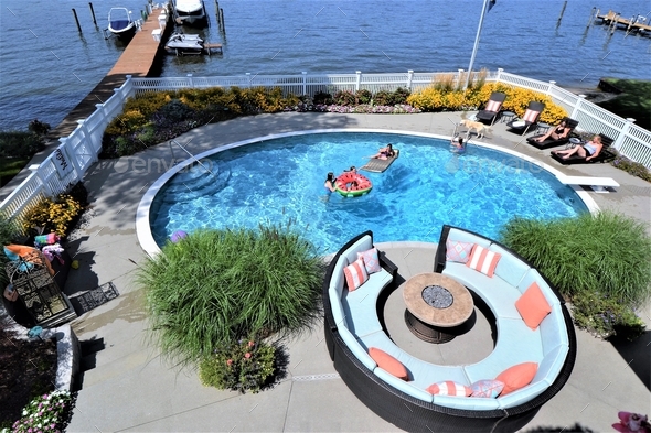 Overhead shot of backyard living space of lake living and inground ...