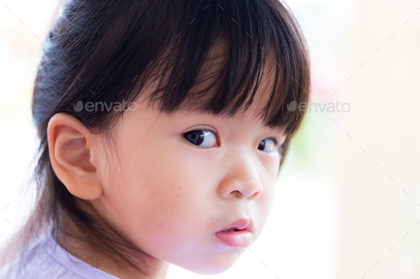 Closeup of face child girl is upset. Stock Photo by kanthitas | PhotoDune