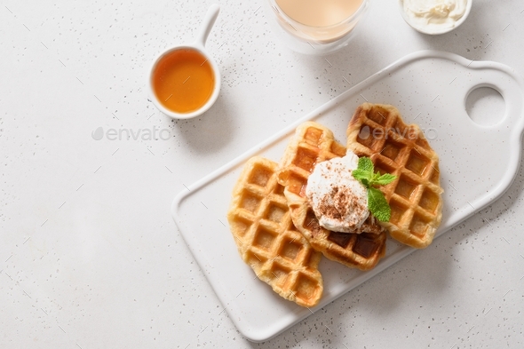 Trendy croffles for delicious breakfast with maple syrup on white ...