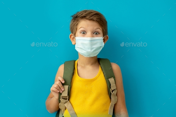 Boy in medical face mask. Surprised people. Schoolboy. Back to school ...