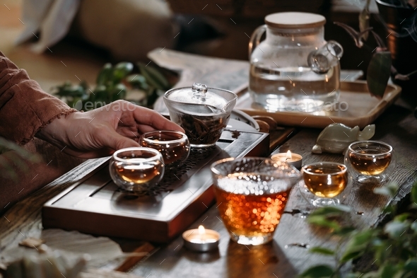Traditional tea ceremony - pouring chinese oolong in glass cup Stock ...