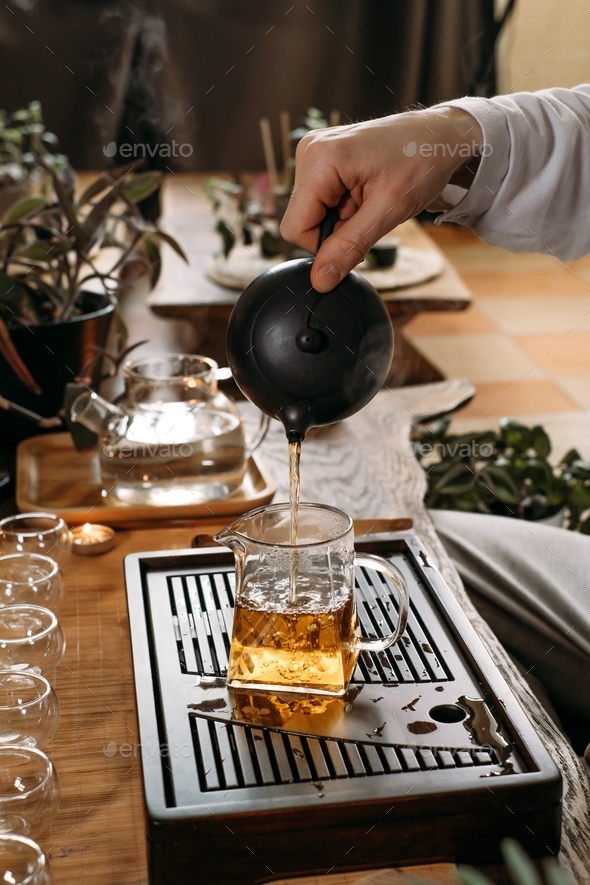 Traditional tea ceremony - pouring chinese oolong in glass cup Stock ...