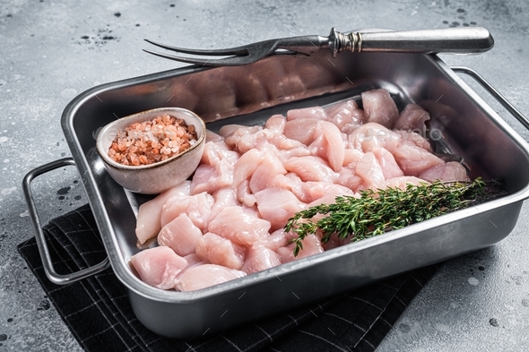 Diced raw chicken breast fillets in steel tray. Stock Photo by ...