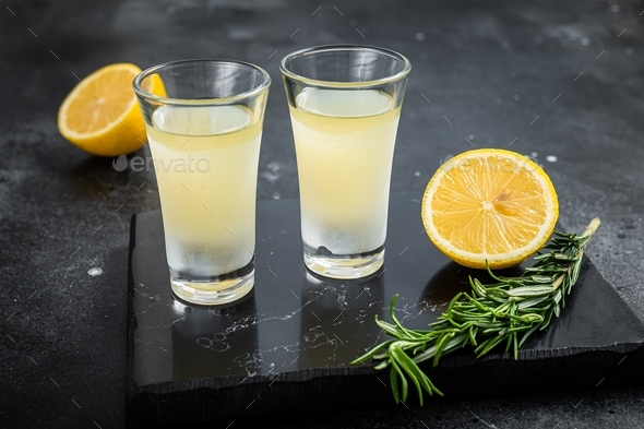 Traditional italian lemon alcohol drink liqueur limoncello with lemon ...