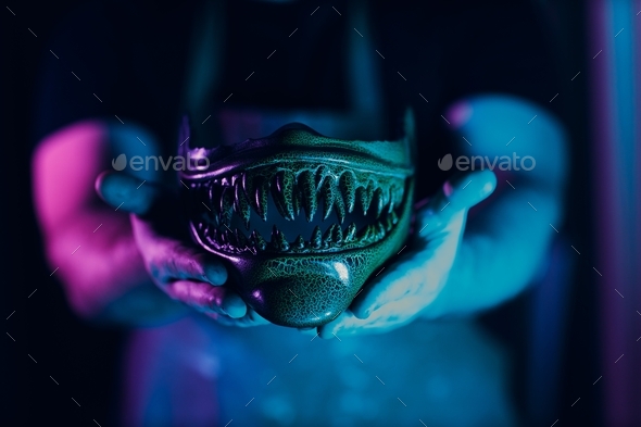 Scary plastic mask. Artisan craftsman create mask based on plaster cast ...