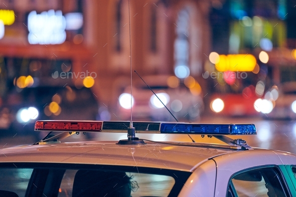 Police car lights at night city street Stock Photo by travelarium