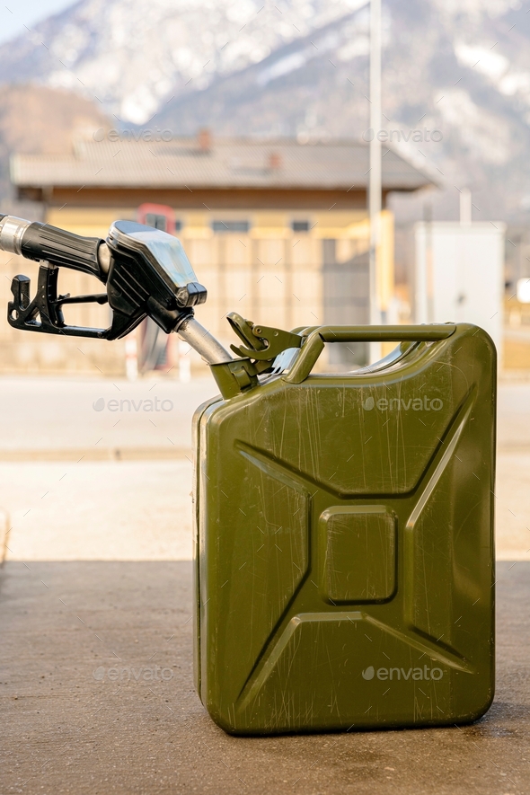 Refilling canister with fuel on the petrol station. Close up view. Fuel ...