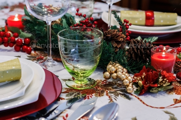 Christmas table decorated in red with a candlelight. Tablescape ...