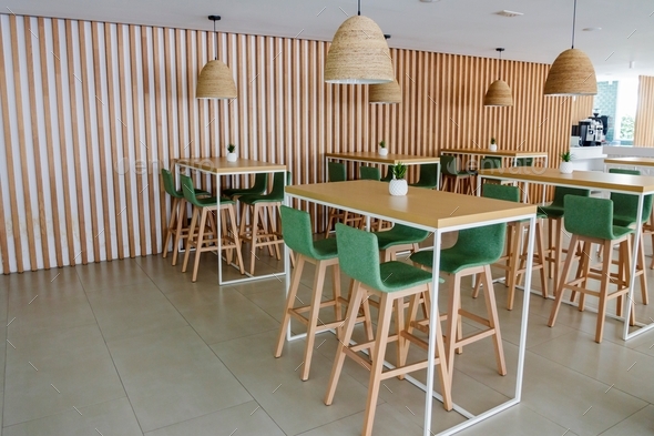 Modern bar in a luxury hotel, modern interior design, tables and chairs ...