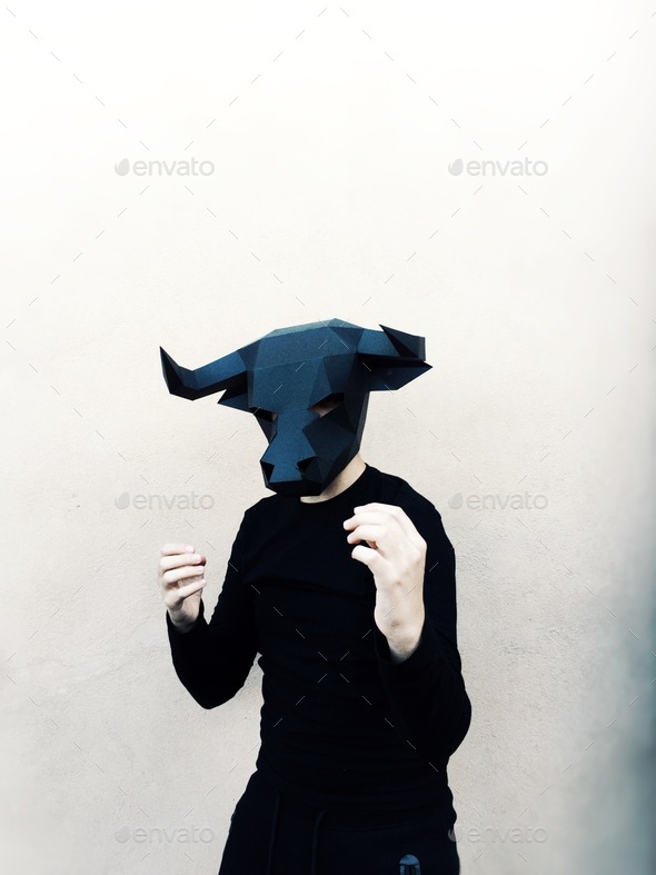 Young millennial wearing low poly bull mask ready for fight Stock Photo ...