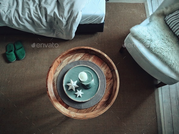 Interior lifestyle overhead view of round coffee table with candles ...