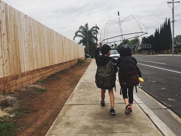 Kids walking home to school Stock Photo by nikmock | PhotoDune