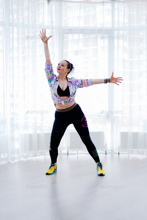 Brunette woman like Zumba dance. Concept active dancing in all around ...