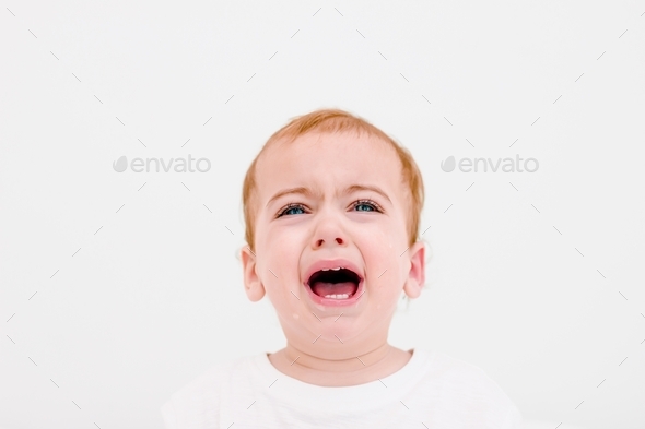 Close-up to babys mouth with two teeth. Drool is drooling from his ...