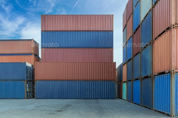 Stack of containers in a harbor. Shipping containers stacked on cargo ...