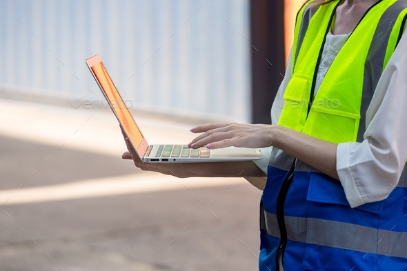 Hand holding computer note book for writing and checking in goods in ...