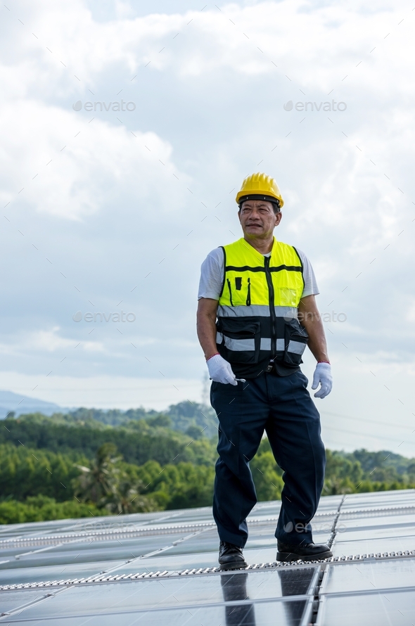 Engineer working setup Solar panel at the roof top. Stock Photo by kckate16