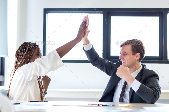Coworkers cooperating and working together at office meeting, teamwork ...