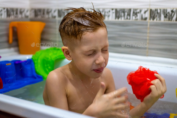 Concepts of cleanliness and health. Personal hygiene, red-haired boy ...
