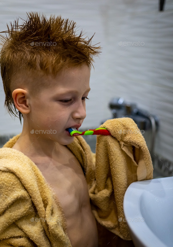 Dental health, Personal hygiene, child redhead boy brushing his teeth ...