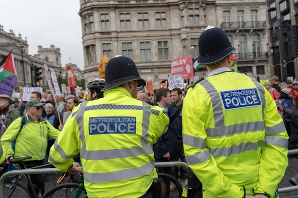 London police at protest, keeping the peace, in high visibility uniform ...