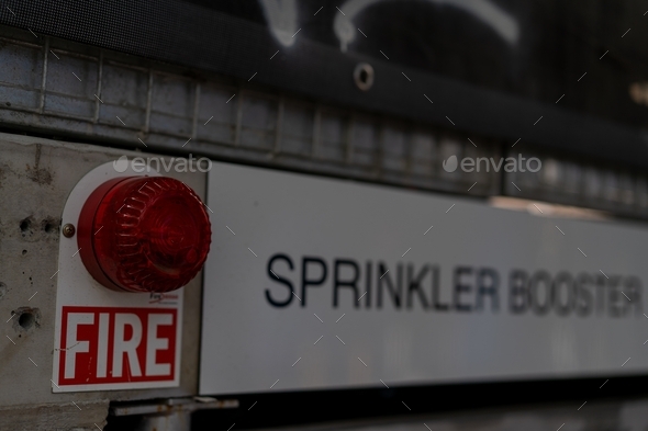 Fire warning Sprinkler Booster warning sign Stock Photo by emneemsphotos