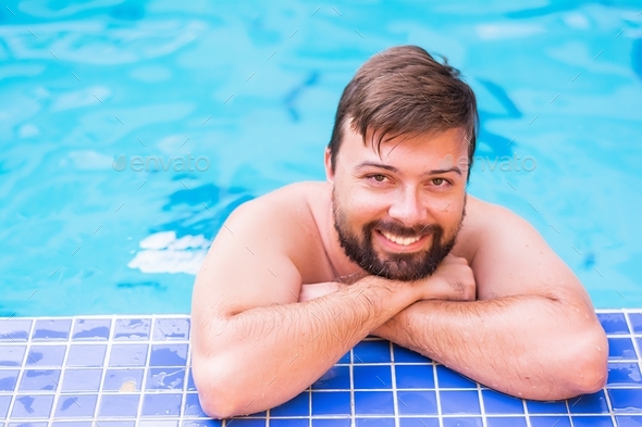 Positive mixed tourist race man with beard in swimming pool positive ...