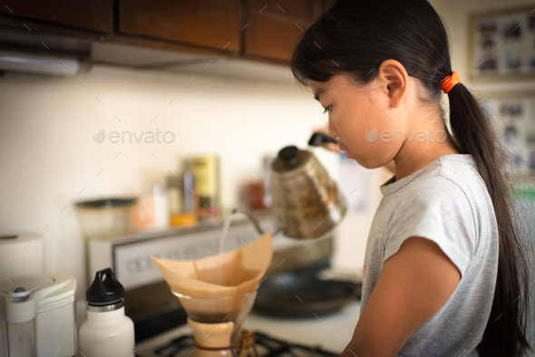 Young girl making coffee in the morning Stock Photo by naokawa | PhotoDune