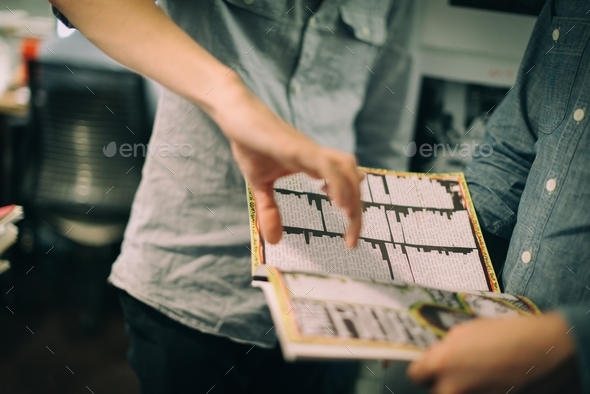 Design critique - person giving directions by hand gestures Stock Photo ...