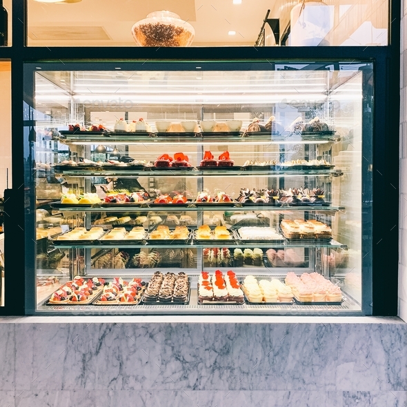 Bakery shop display with multiples of personal size cakes Stock Photo ...