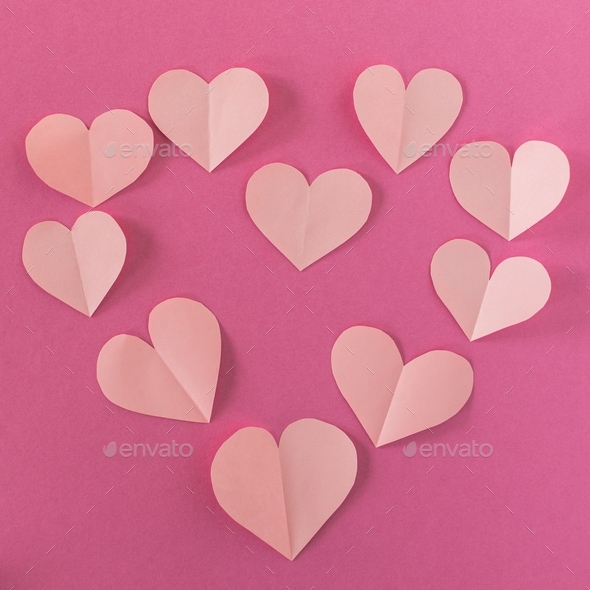 Paper pastel pink hearts on a pink background. the concept of romance ...